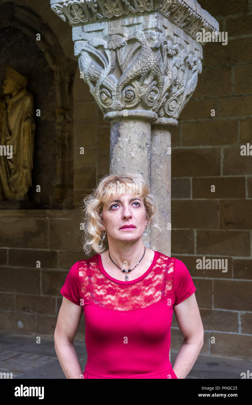 Woman in a cloister Stock Photo - Alamy