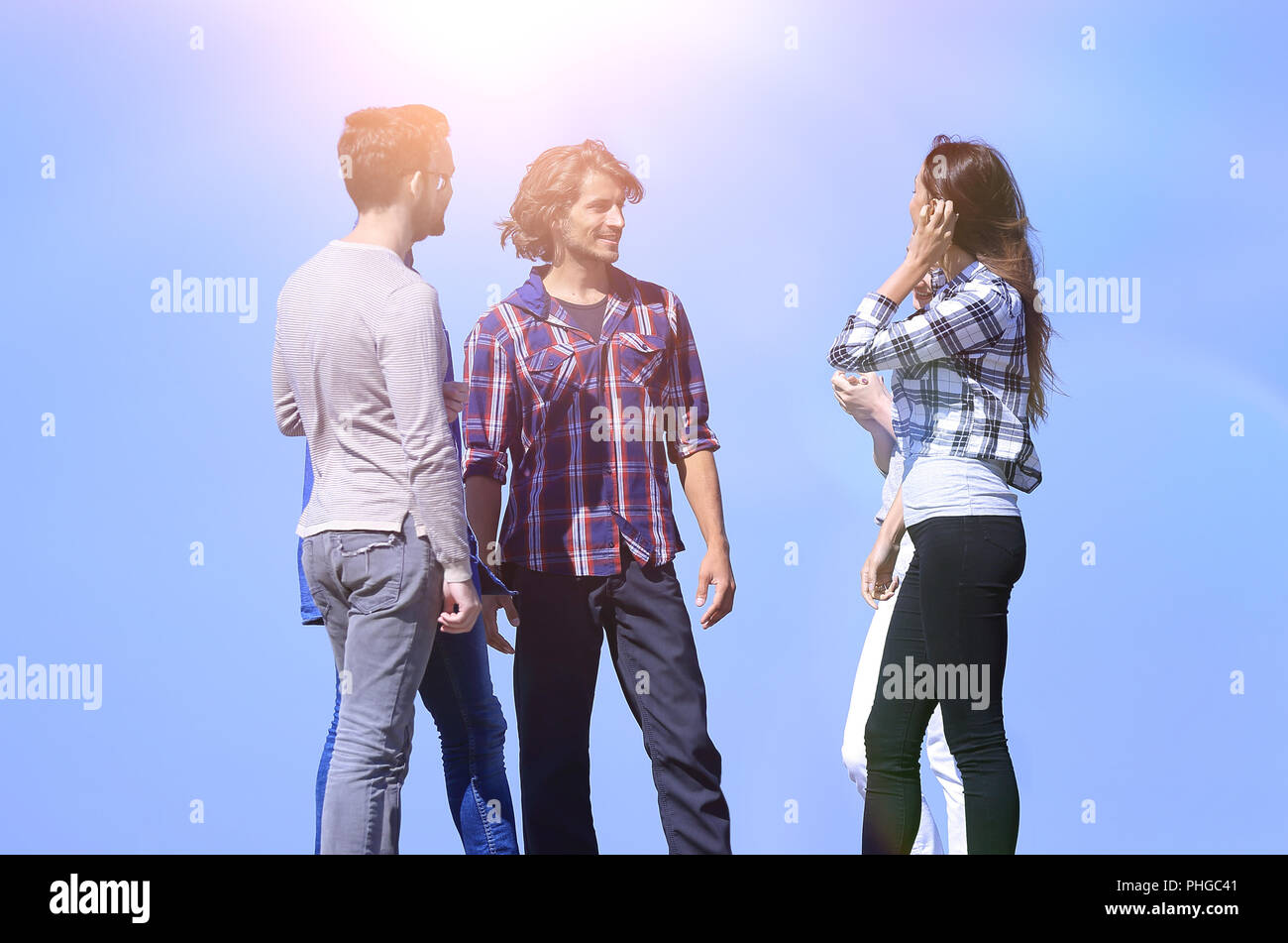 group of students talking while standing outdoors Stock Photo - Alamy