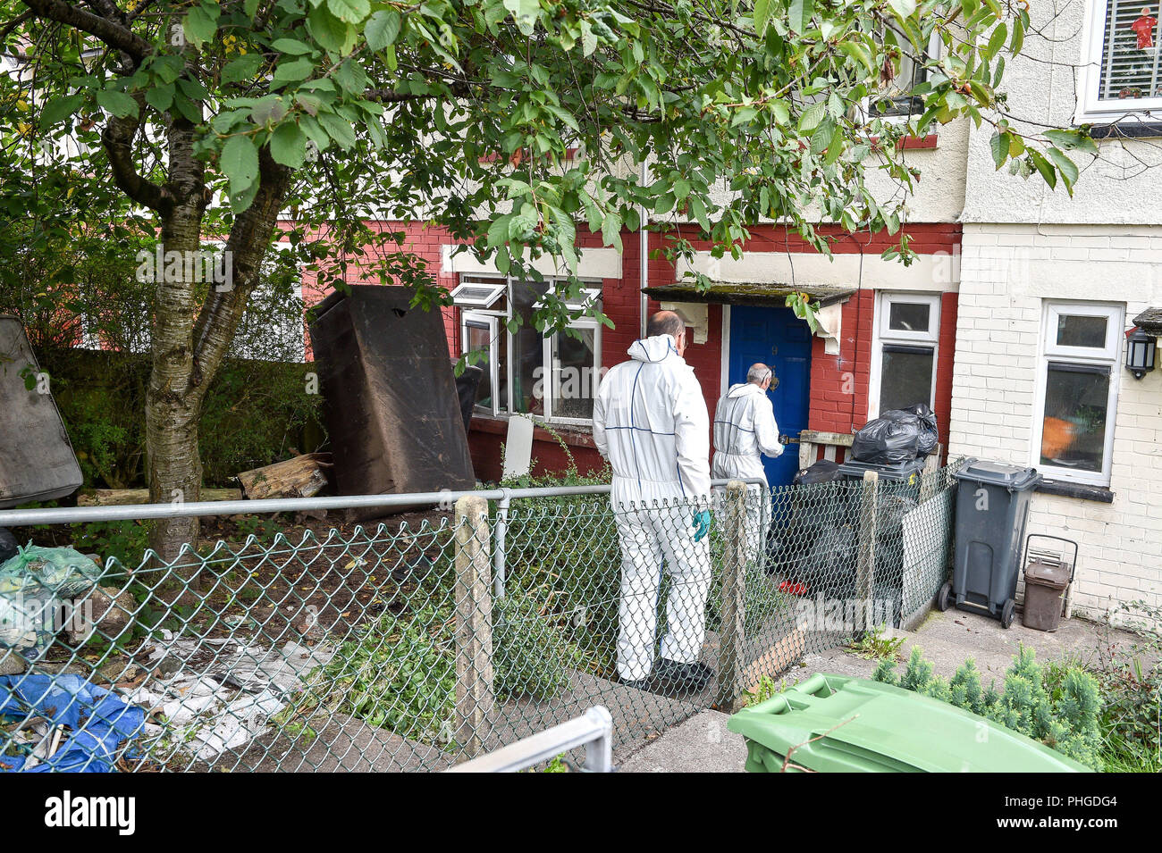 Police forensic officers enter a property on Archer Crescent, Ely ...