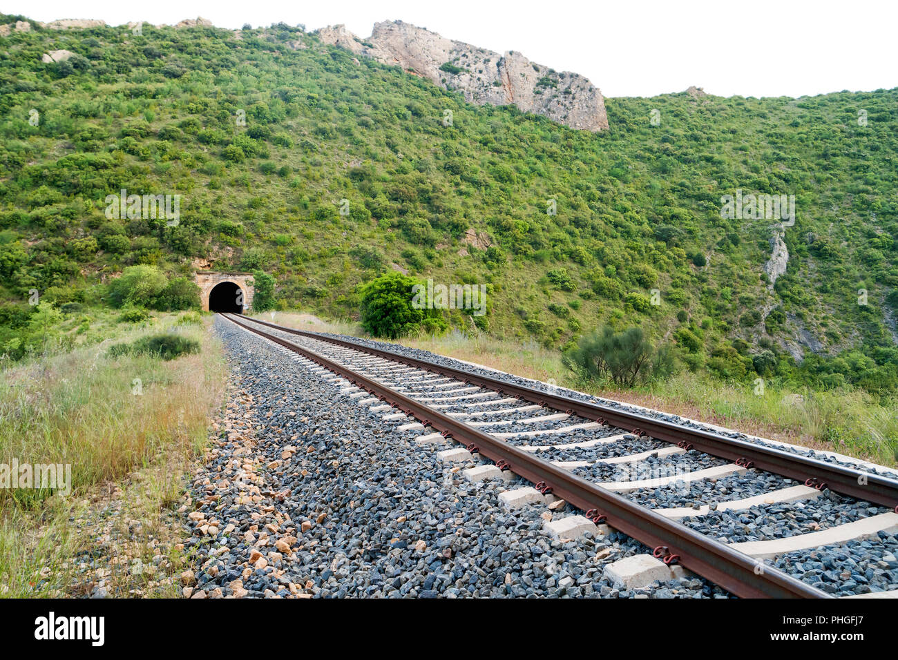 Old train tunnel with railway Stock Photo - Alamy
