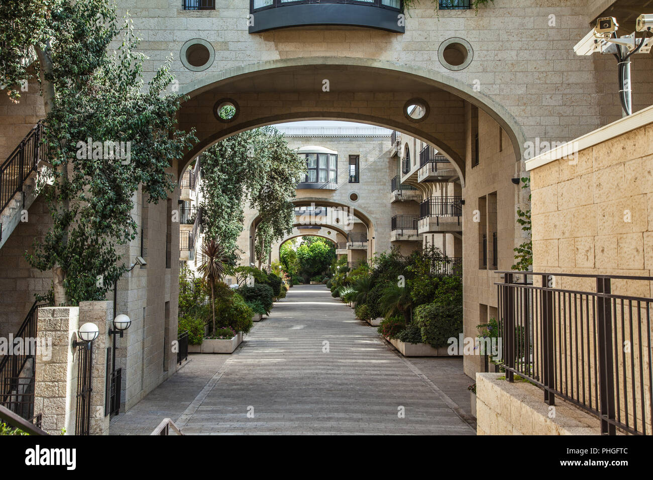 Elegant arched passageway between buildings Stock Photo - Alamy
