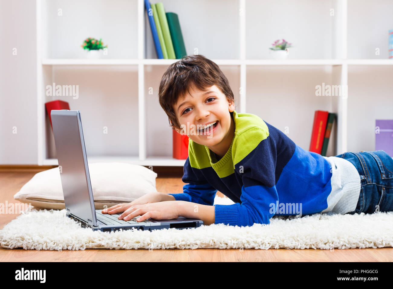 Little boy using laptop Stock Photo - Alamy