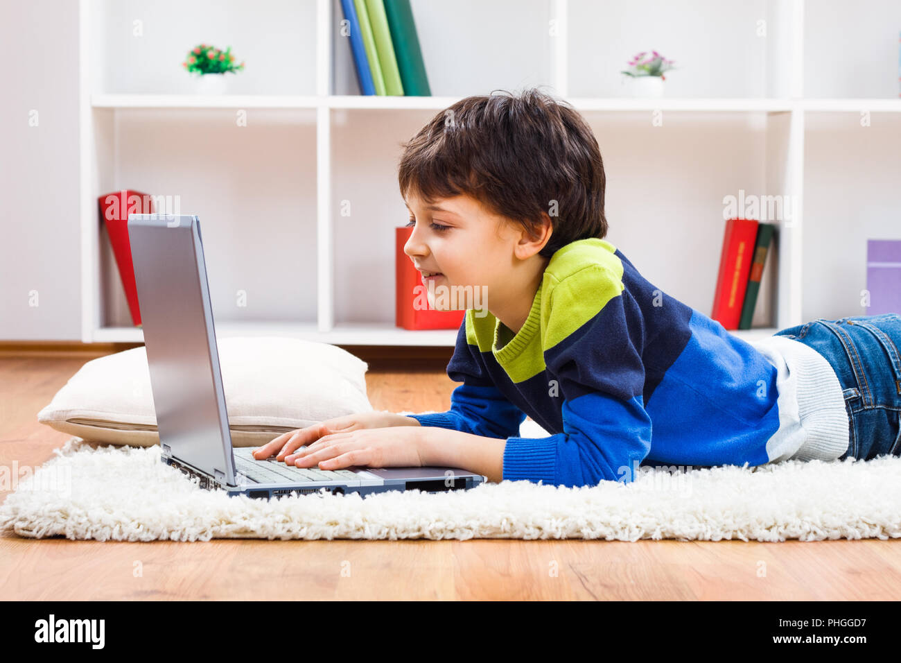 Little boy using laptop Stock Photo - Alamy