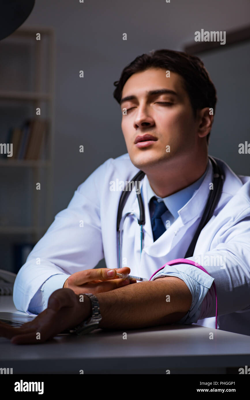 Doctor drug addict staying late on hospital Stock Photo - Alamy