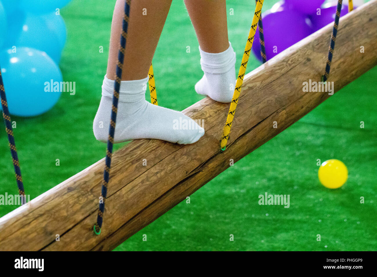 Children's feet at the playground with swinging bridge Stock Photo - Alamy