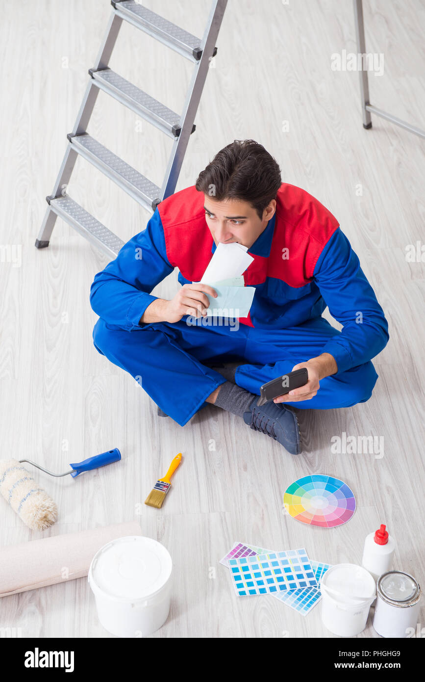Young painter trying to match colours for painting job Stock Photo - Alamy