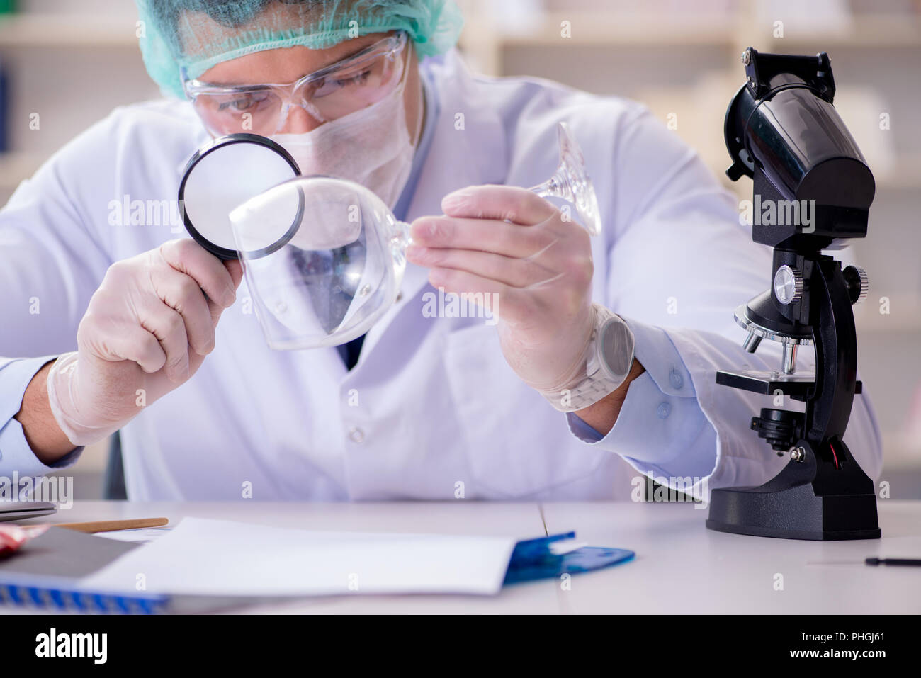 Forensics investigator working in lab on crime evidence Stock Photo - Alamy