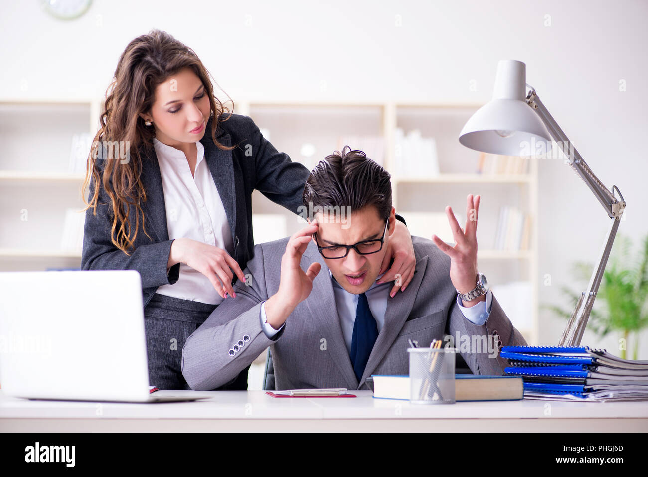 Unhappy boss having a chat with his secretary Stock Photo - Alamy