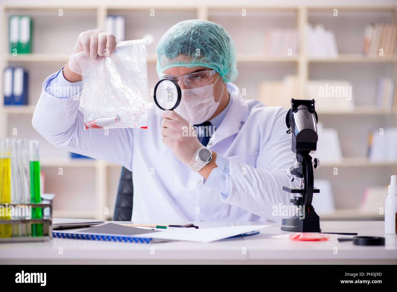 Forensics investigator working in lab on crime evidence Stock Photo - Alamy