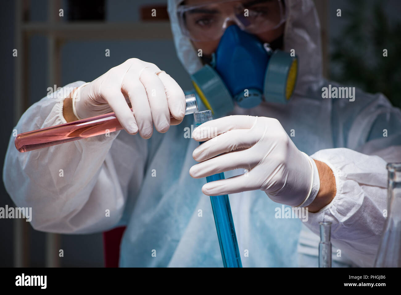Young make scientist working with dangerous hazardous substances Stock ...