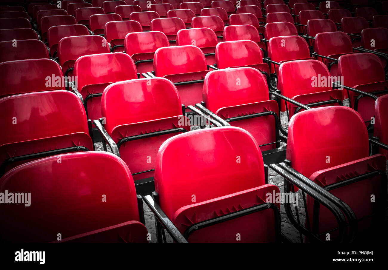Red seats into the outdoor theatre Stock Photo - Alamy