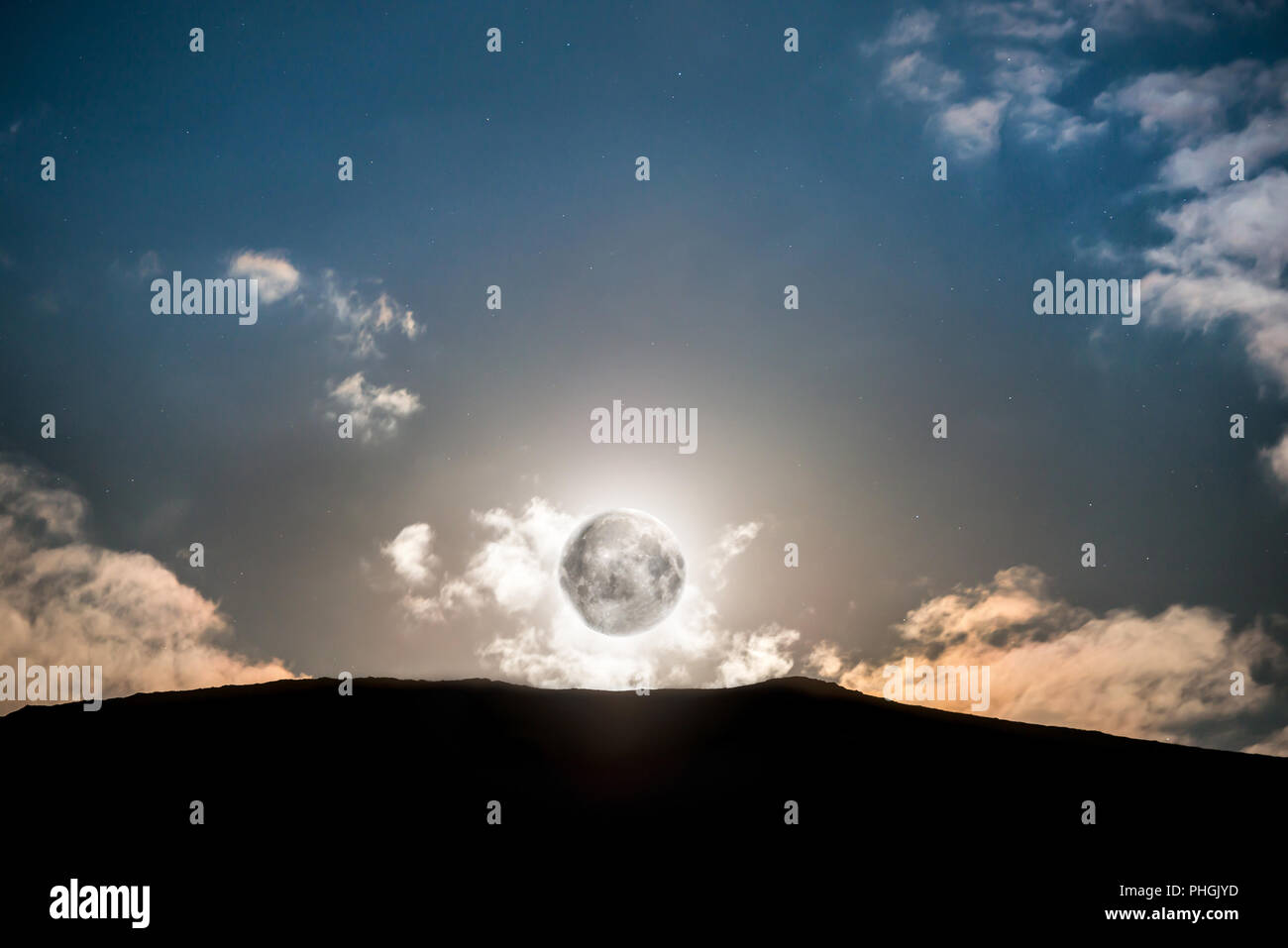 Raising of full moon above mountain Stock Photo - Alamy