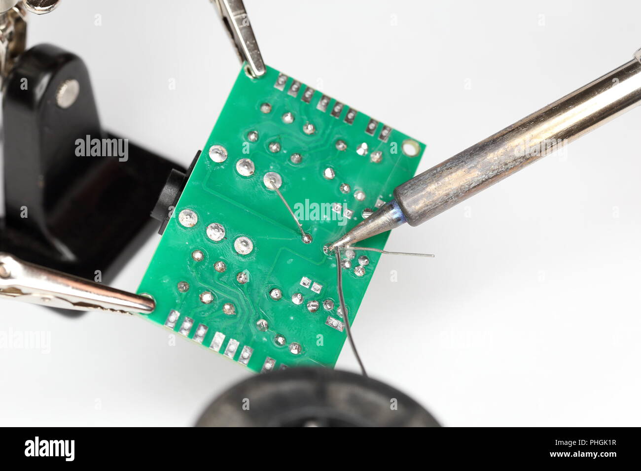 Repairman soldering electronic components hi-res stock photography and ...