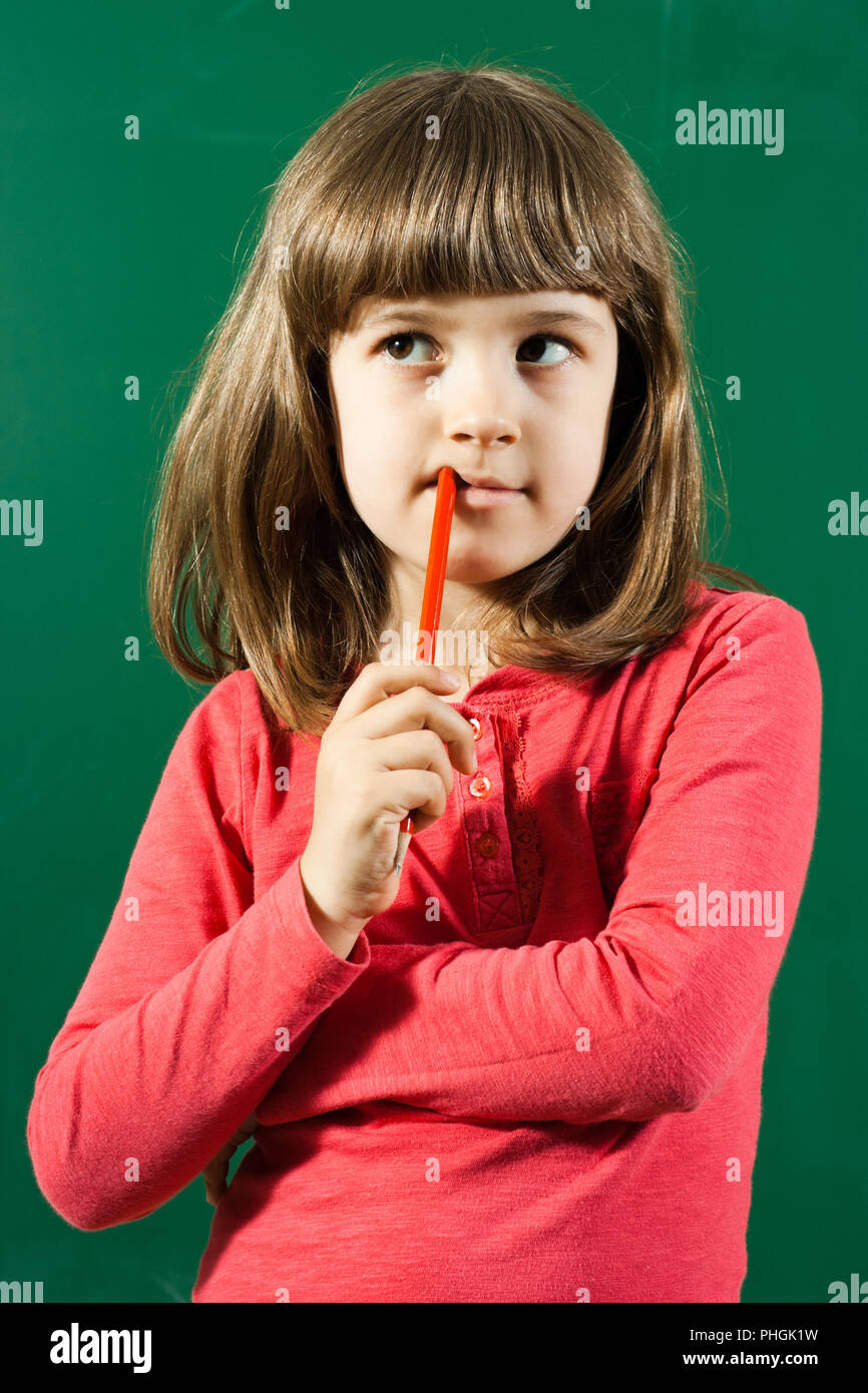 Little girl thinking Stock Photo - Alamy