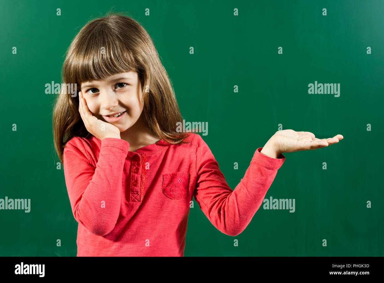 Little girl holding your product Stock Photo - Alamy