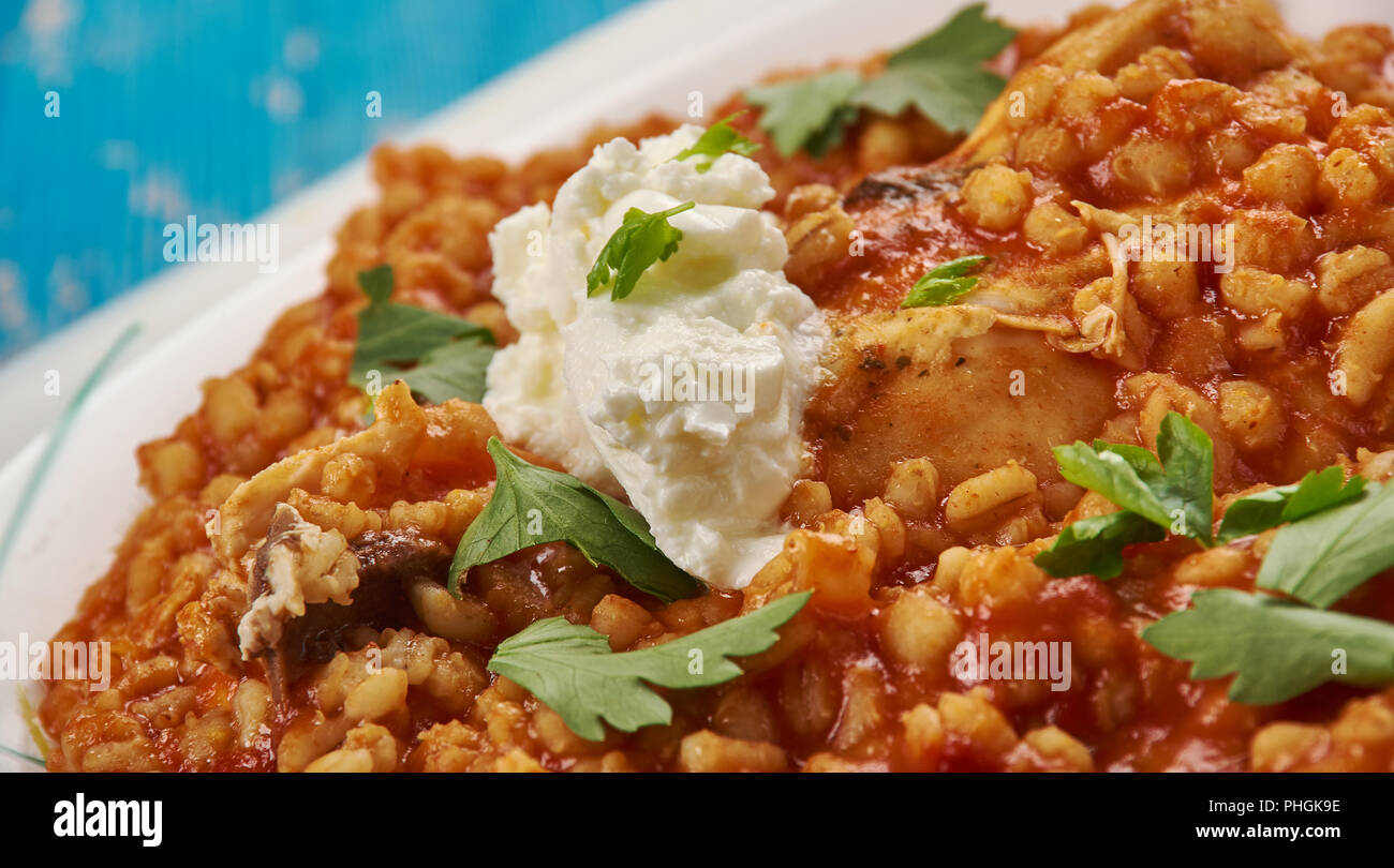 Barley risotto with marinated chicken Stock Photo - Alamy