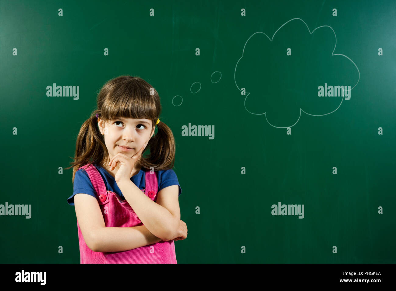 Little girl thinking Stock Photo - Alamy