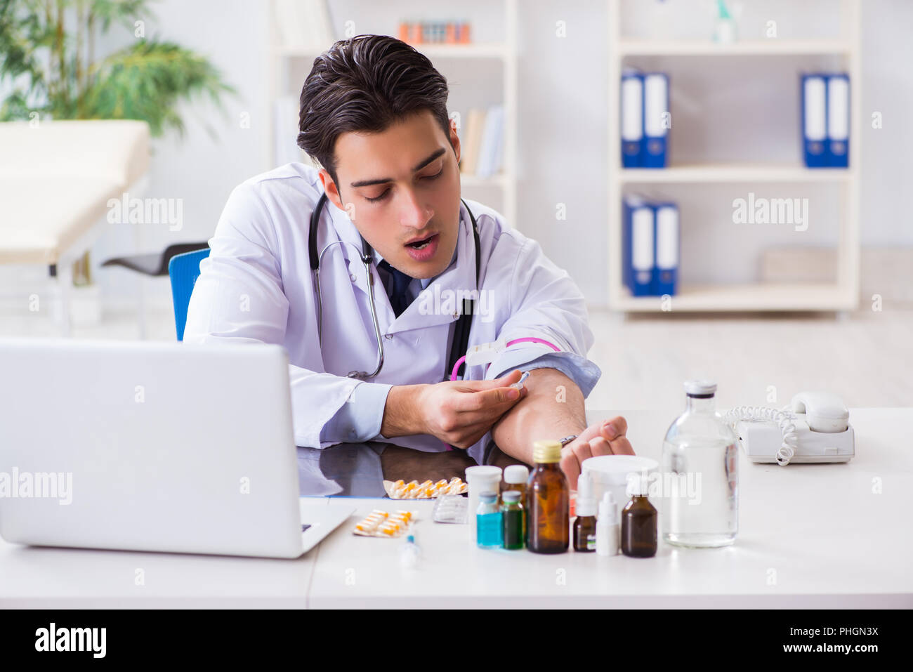 Doctor drug addict in the hospital Stock Photo - Alamy