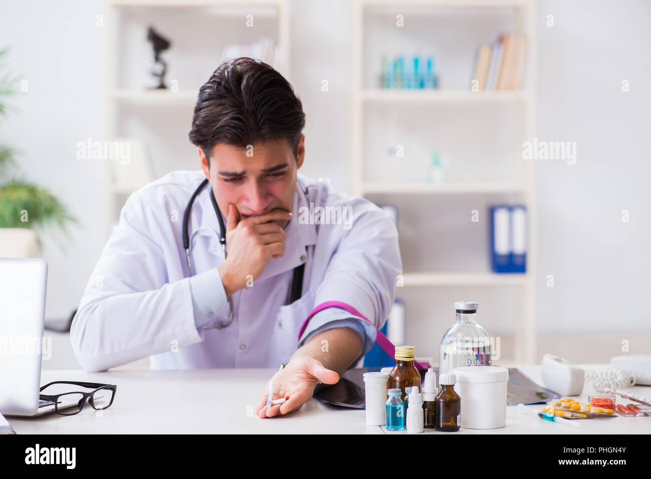 Doctor drug addict in the hospital Stock Photo - Alamy