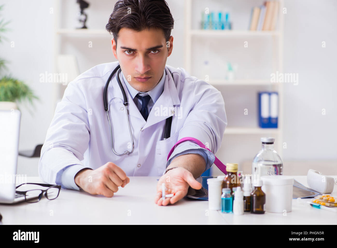 Doctor drug addict in the hospital Stock Photo - Alamy