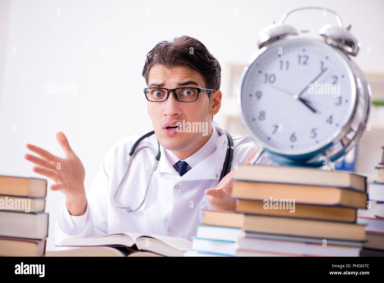 Medical student running out of time for exams Stock Photo - Alamy