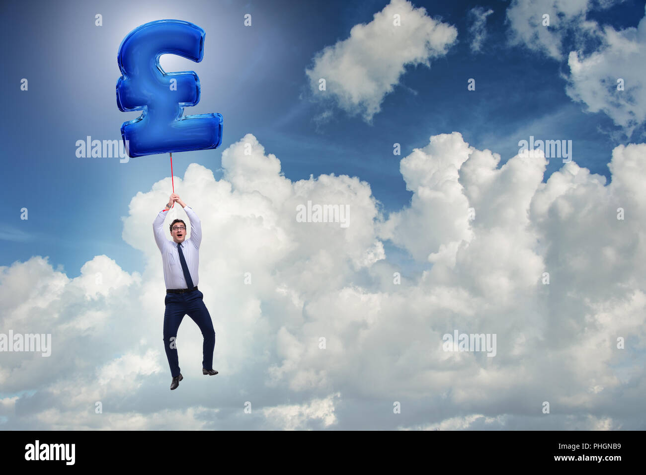 Businessman flying on british pound sign inflatable balloon Stock Photo ...