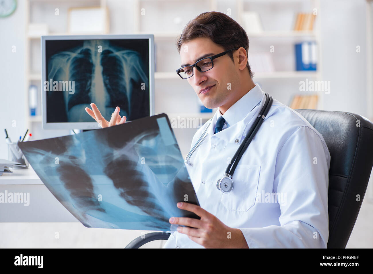 Doctor radiologist looking at x-ray images Stock Photo - Alamy