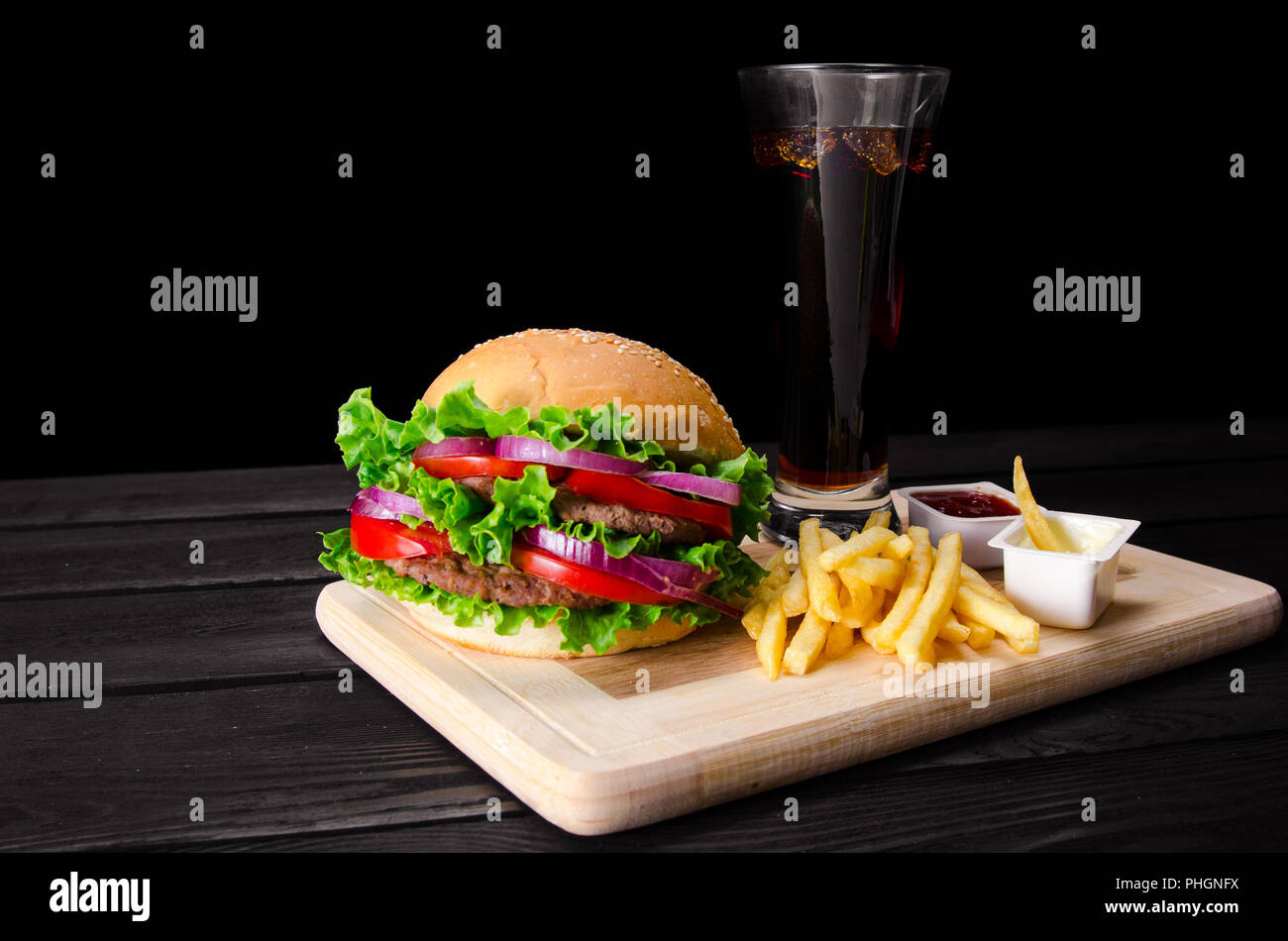 Burger served in bun in nutrition fast food concept Stock Photo - Alamy