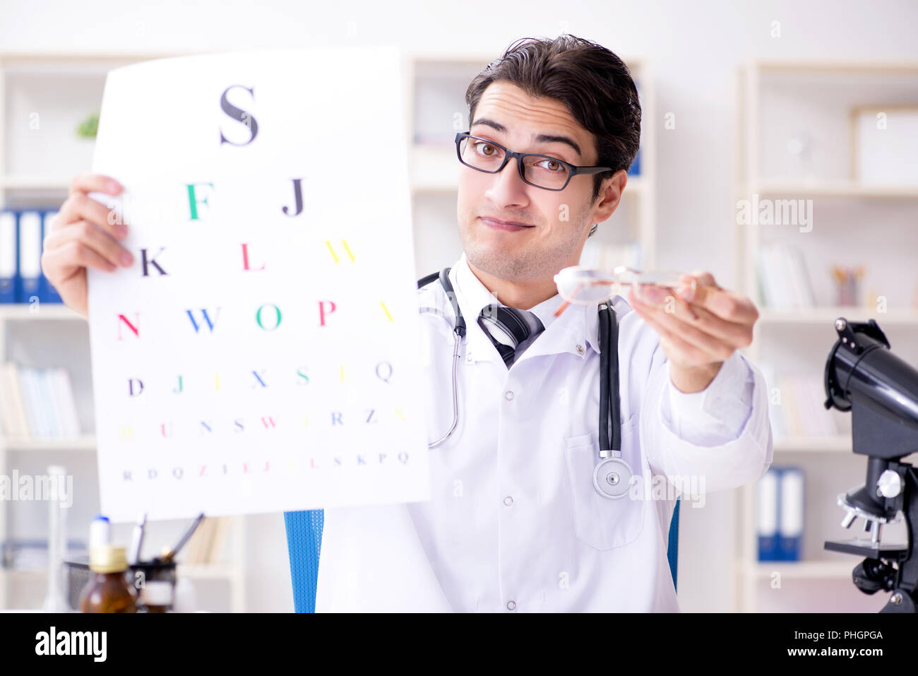 Eye doctor in medical concept Stock Photo - Alamy