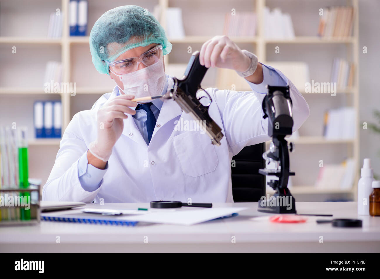 Forensics investigator working in lab on crime evidence Stock Photo - Alamy