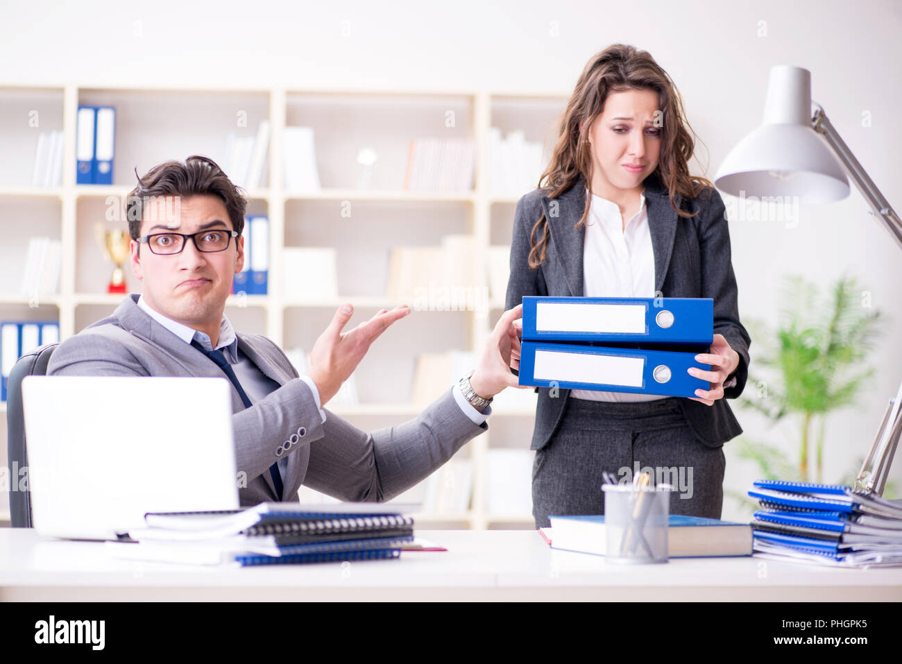 Angry boss unhappy with female employee performance Stock Photo - Alamy