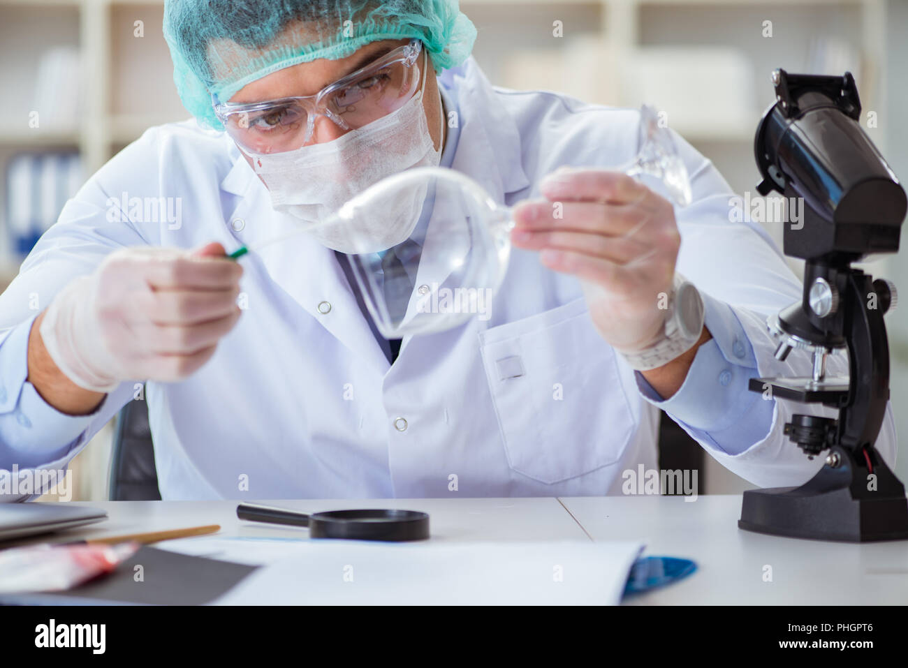 Forensics investigator working in lab on crime evidence Stock Photo - Alamy
