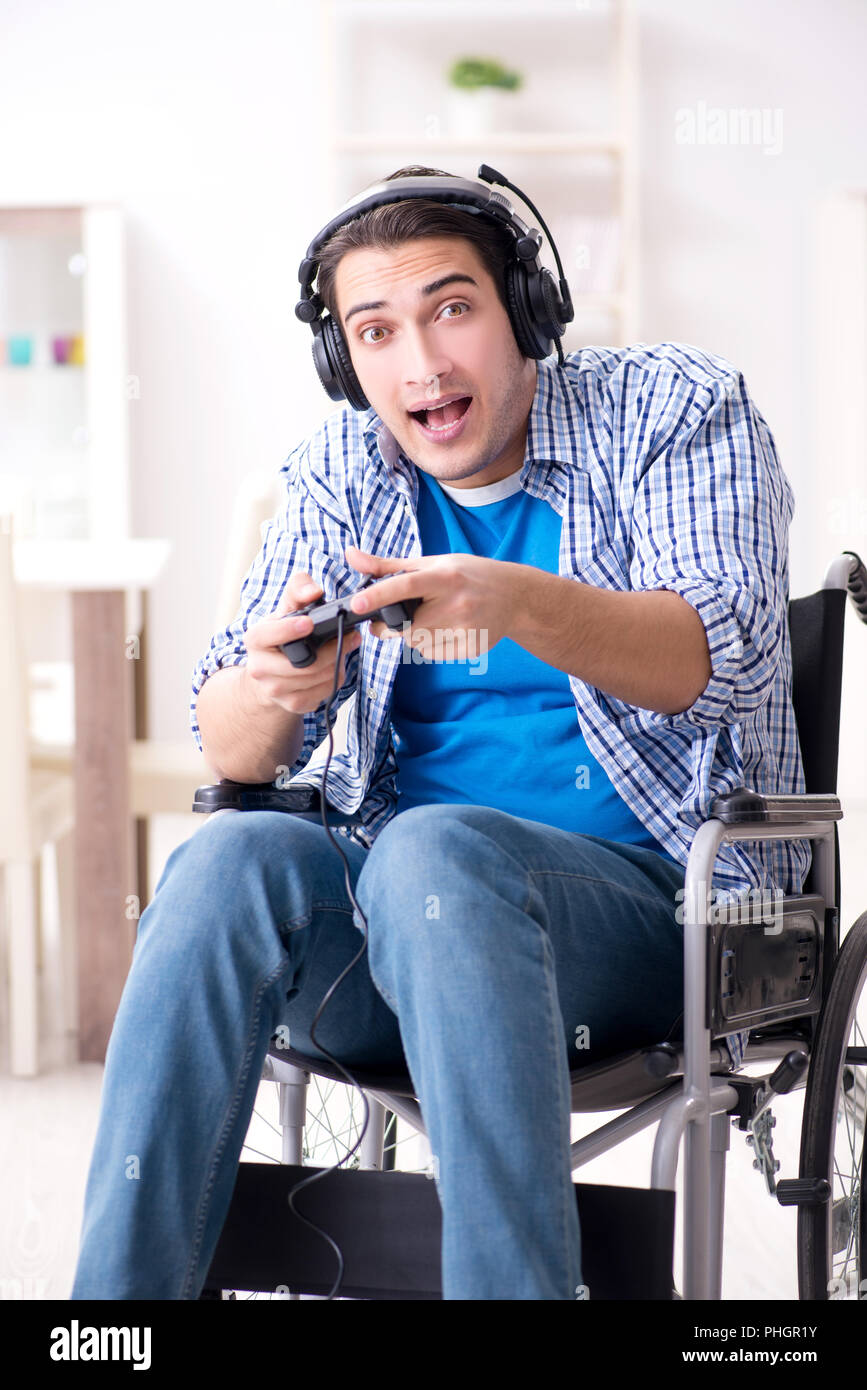 Disabled man playing computer games during rehabilitation Stock Photo ...