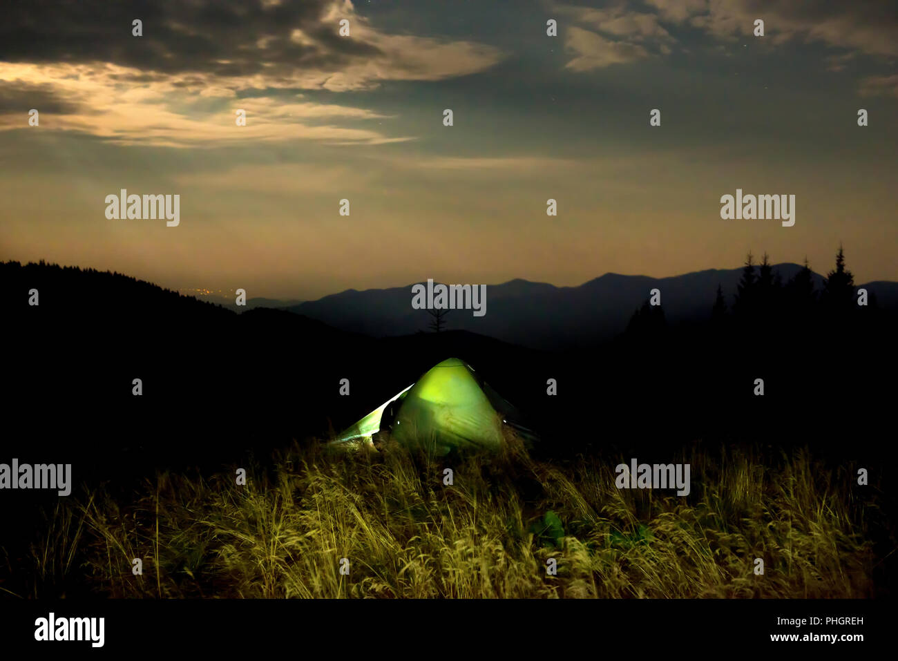 Illuminated green tent night hi-res stock photography and images - Alamy