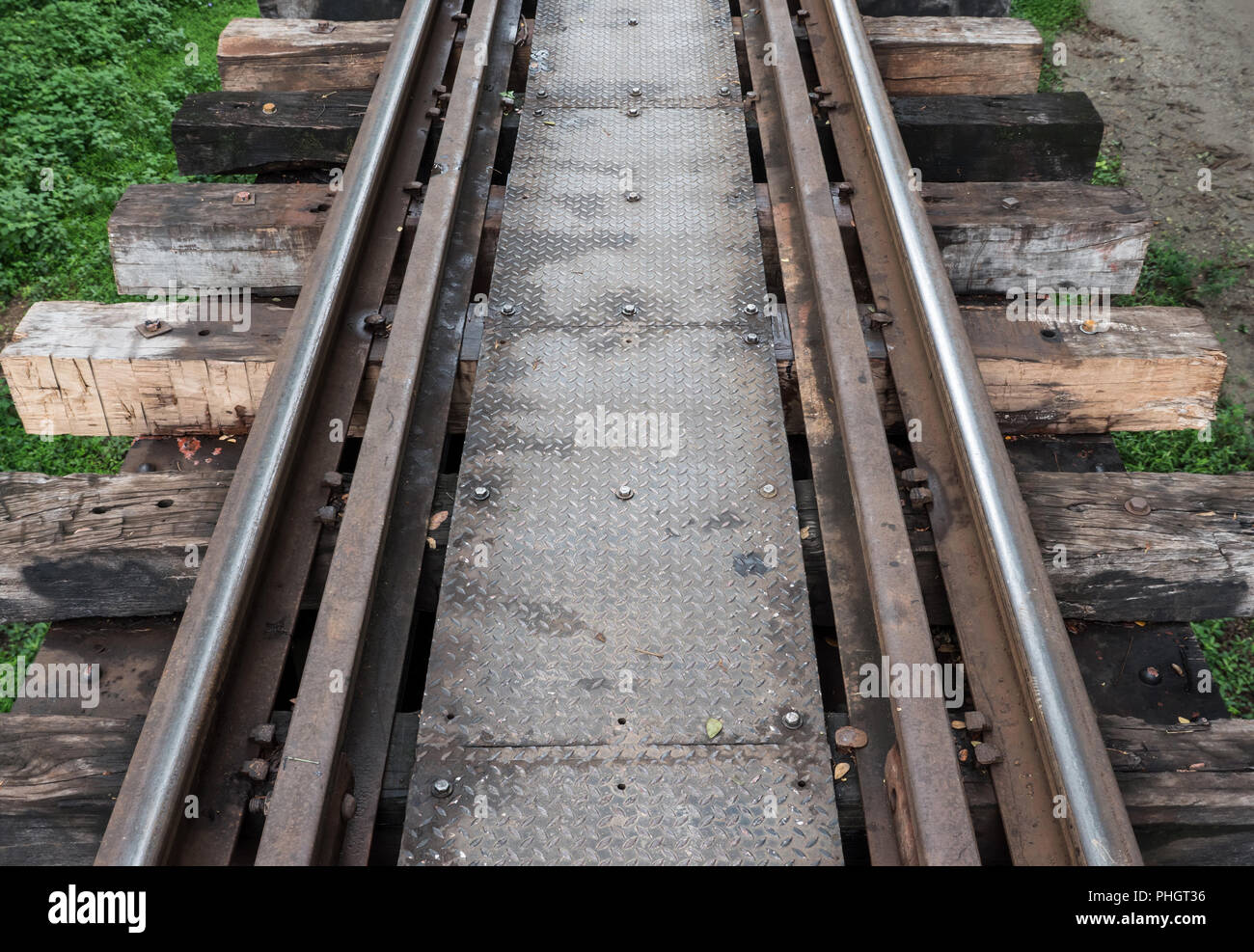 Old railway line with the metal board walkway for the traveler to walk ...