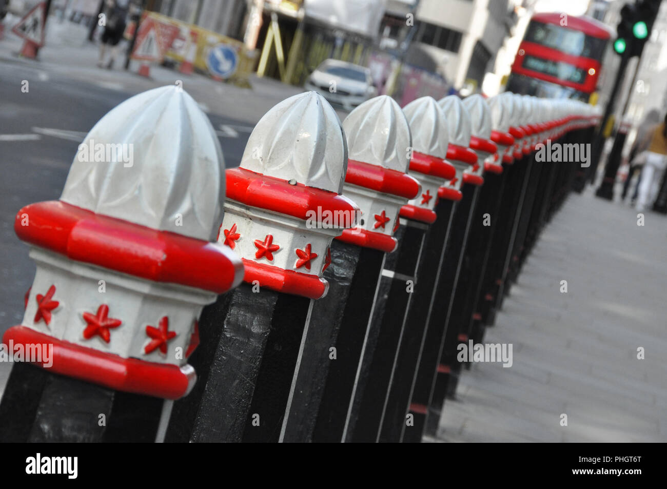 London street bollards and bus, England Stock Photo - Alamy