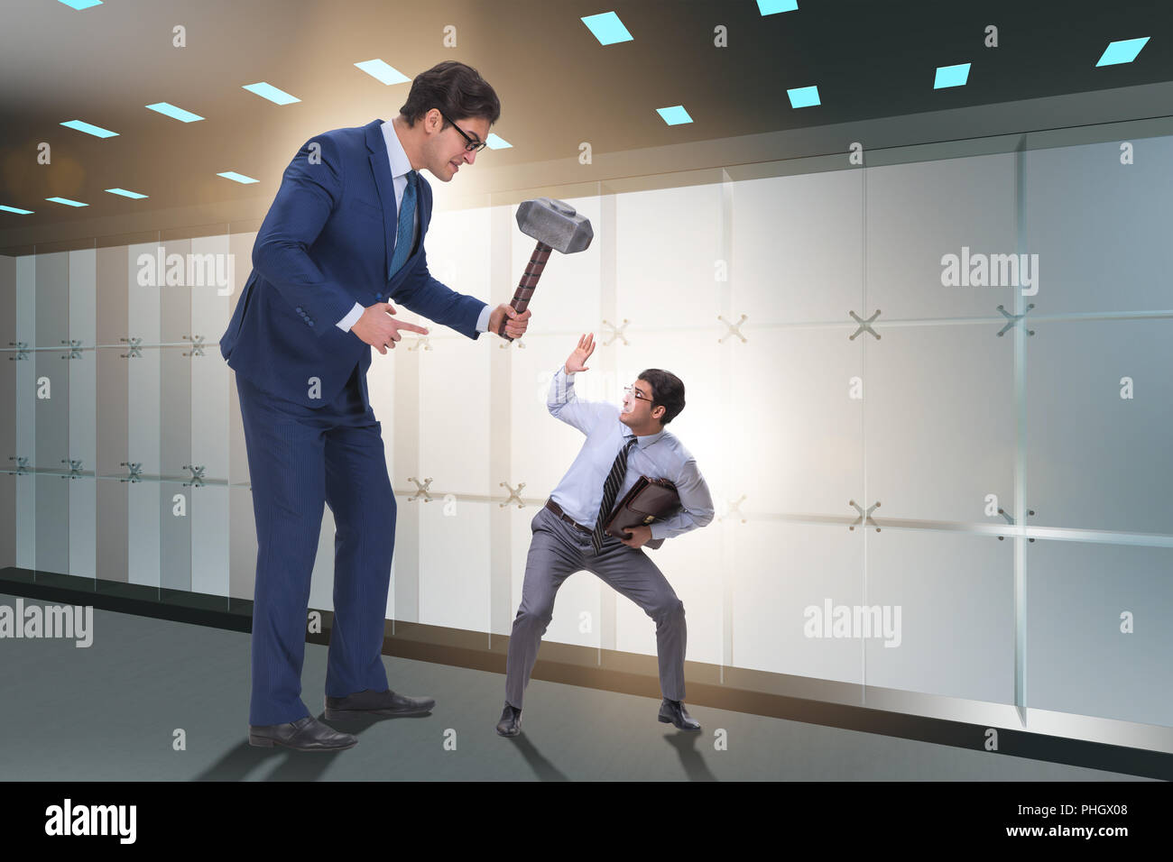 Bad angry boss threatening employee with hammer Stock Photo - Alamy