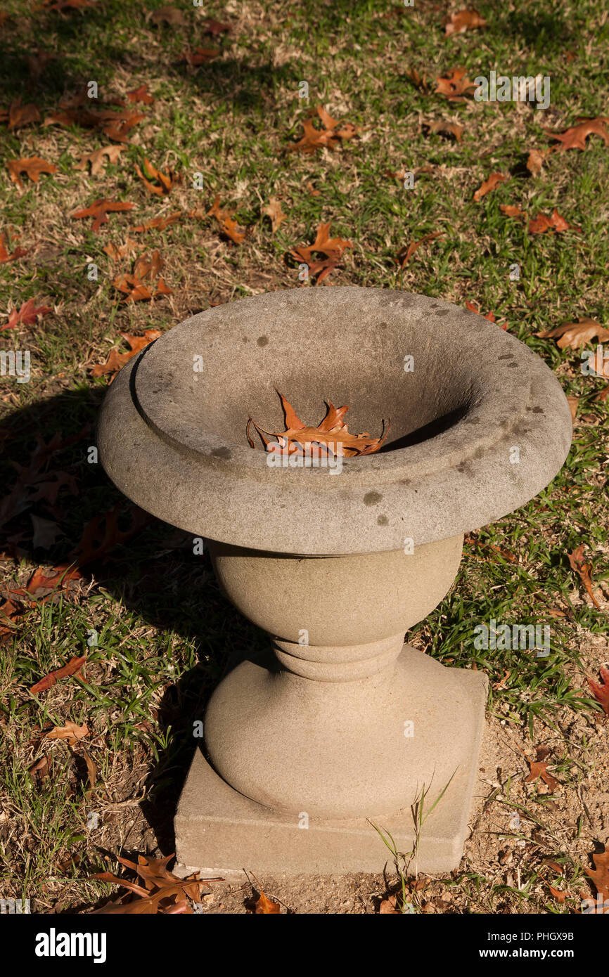 Sydney Australia, autumn leaves in garden urn and across the lawn Stock ...