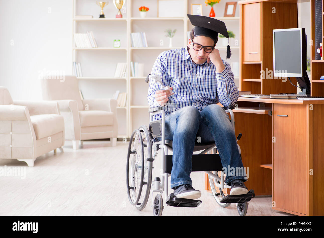 Disabled student studying at home on wheelchair Stock Photo - Alamy
