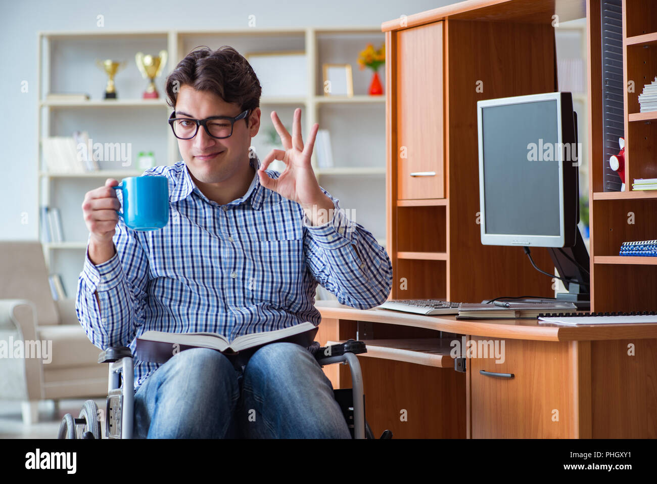 Disabled student studying at home on wheelchair Stock Photo - Alamy