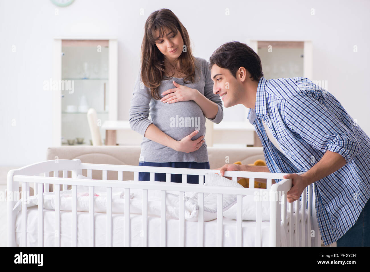 Young parents expecting their first baby Stock Photo - Alamy