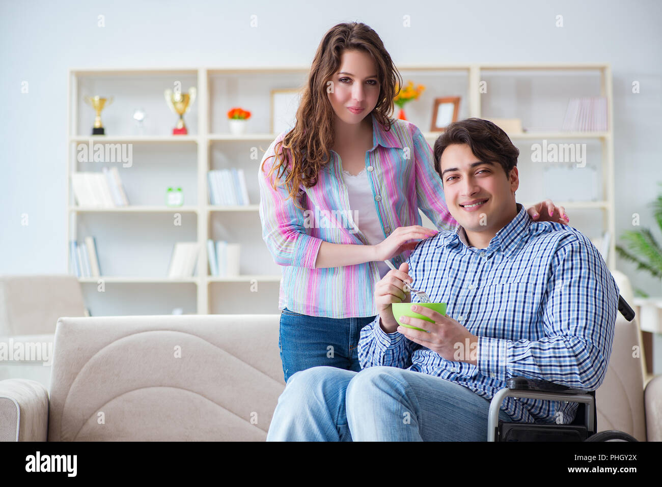 Young family taking care of each other Stock Photo - Alamy