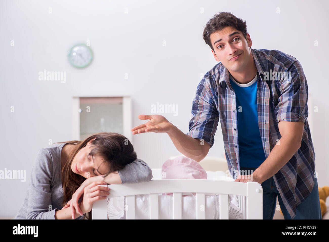 Young dad cannot stand baby crying Stock Photo - Alamy