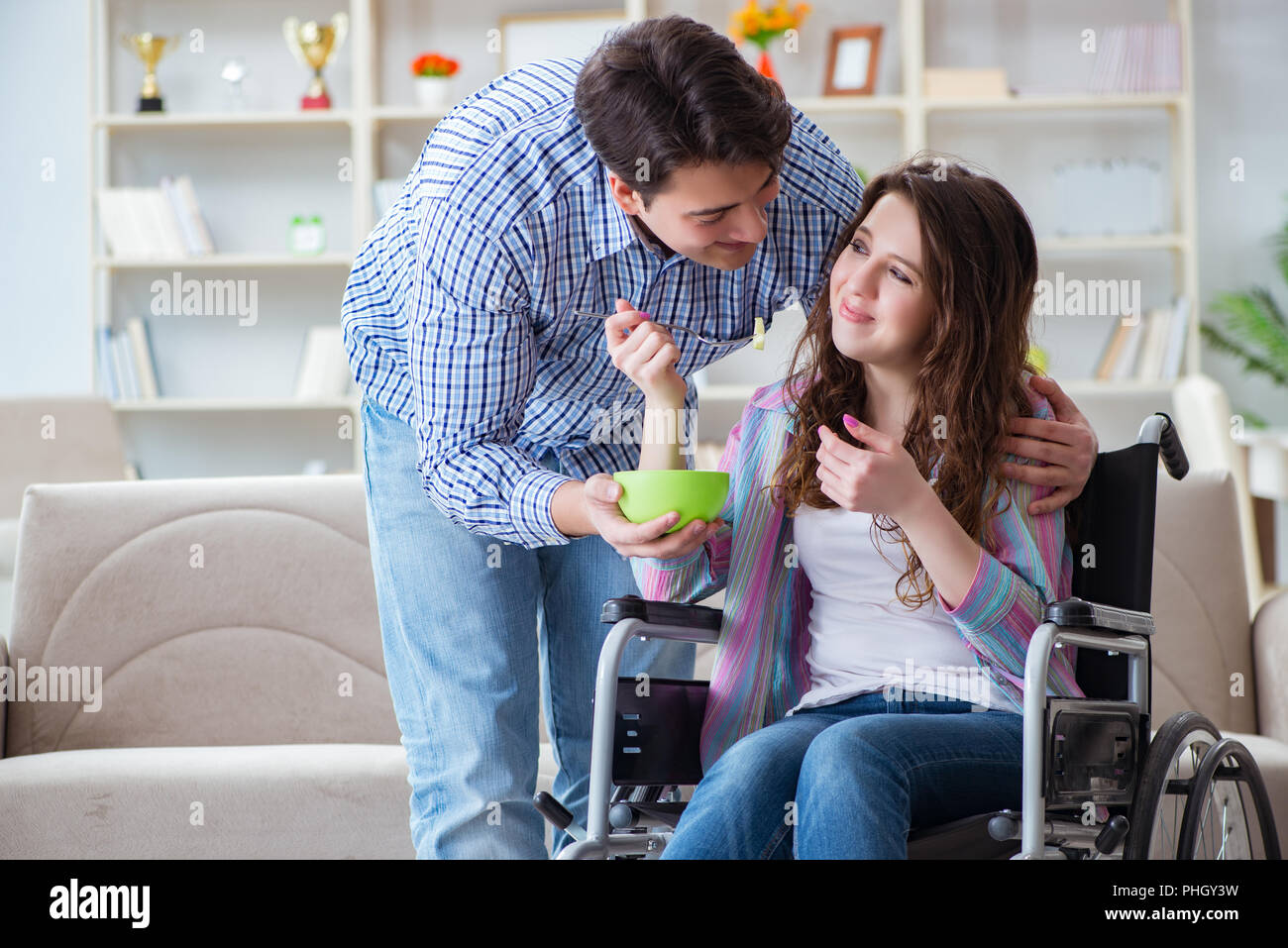 Young family taking care of each other Stock Photo - Alamy