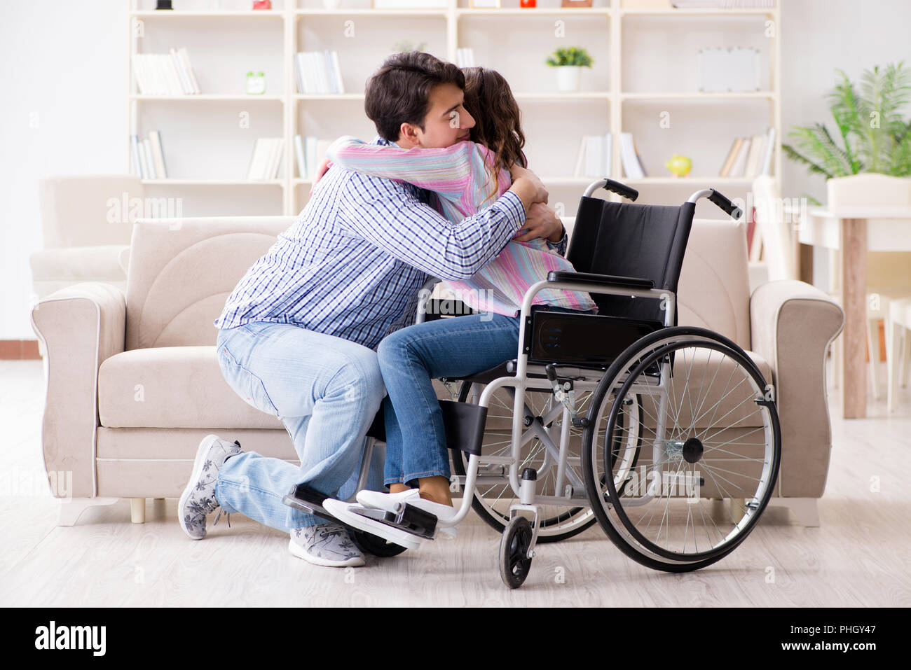 Young family taking care of each other Stock Photo - Alamy