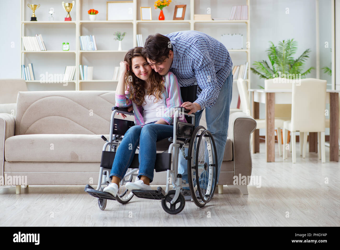 Young family taking care of each other Stock Photo - Alamy