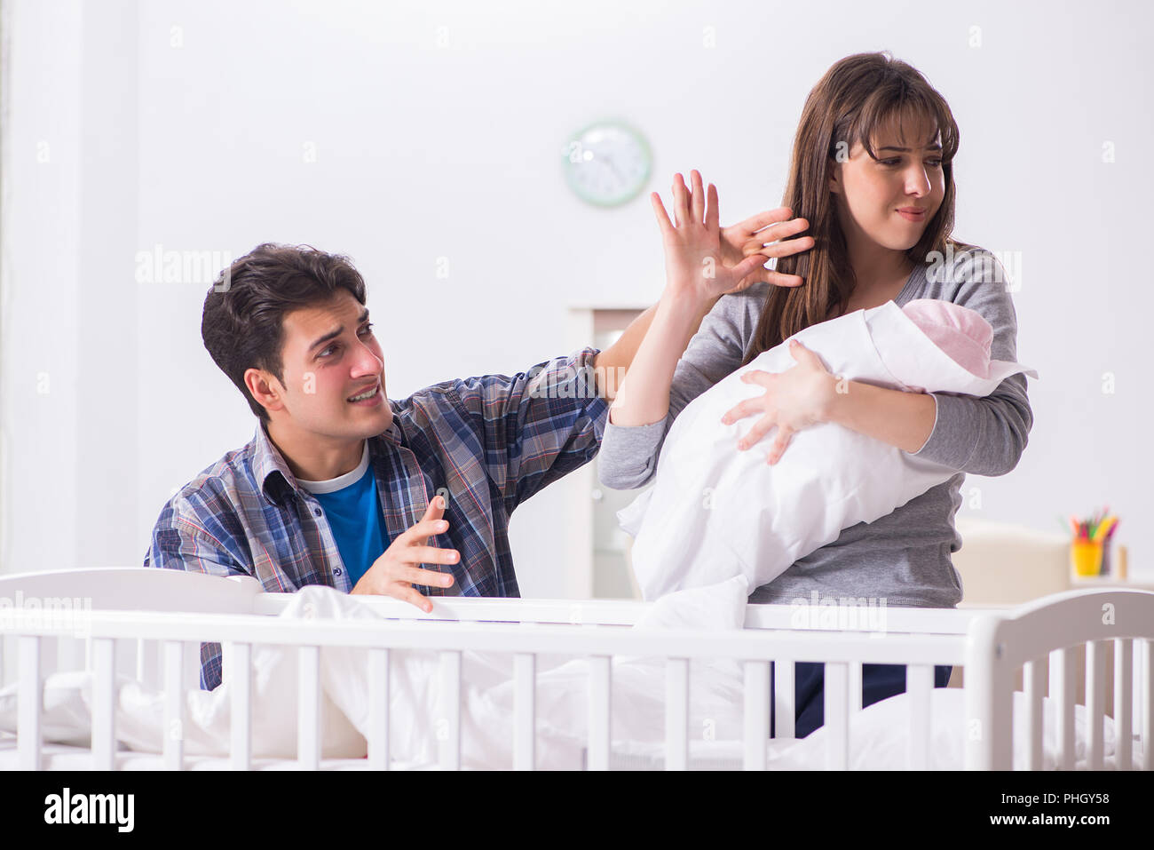 Young dad cannot stand baby crying Stock Photo - Alamy