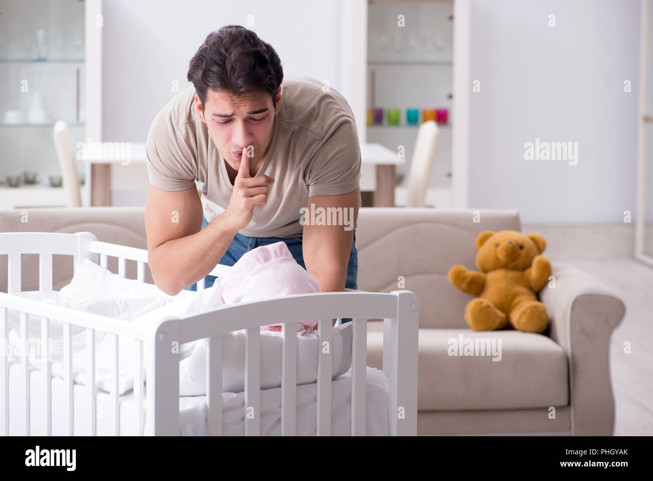 Young father dad frustrated at crying baby Stock Photo - Alamy