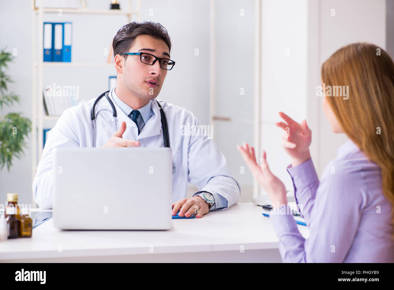 Patient visiting doctor for medical check-up in hospital Stock Photo ...