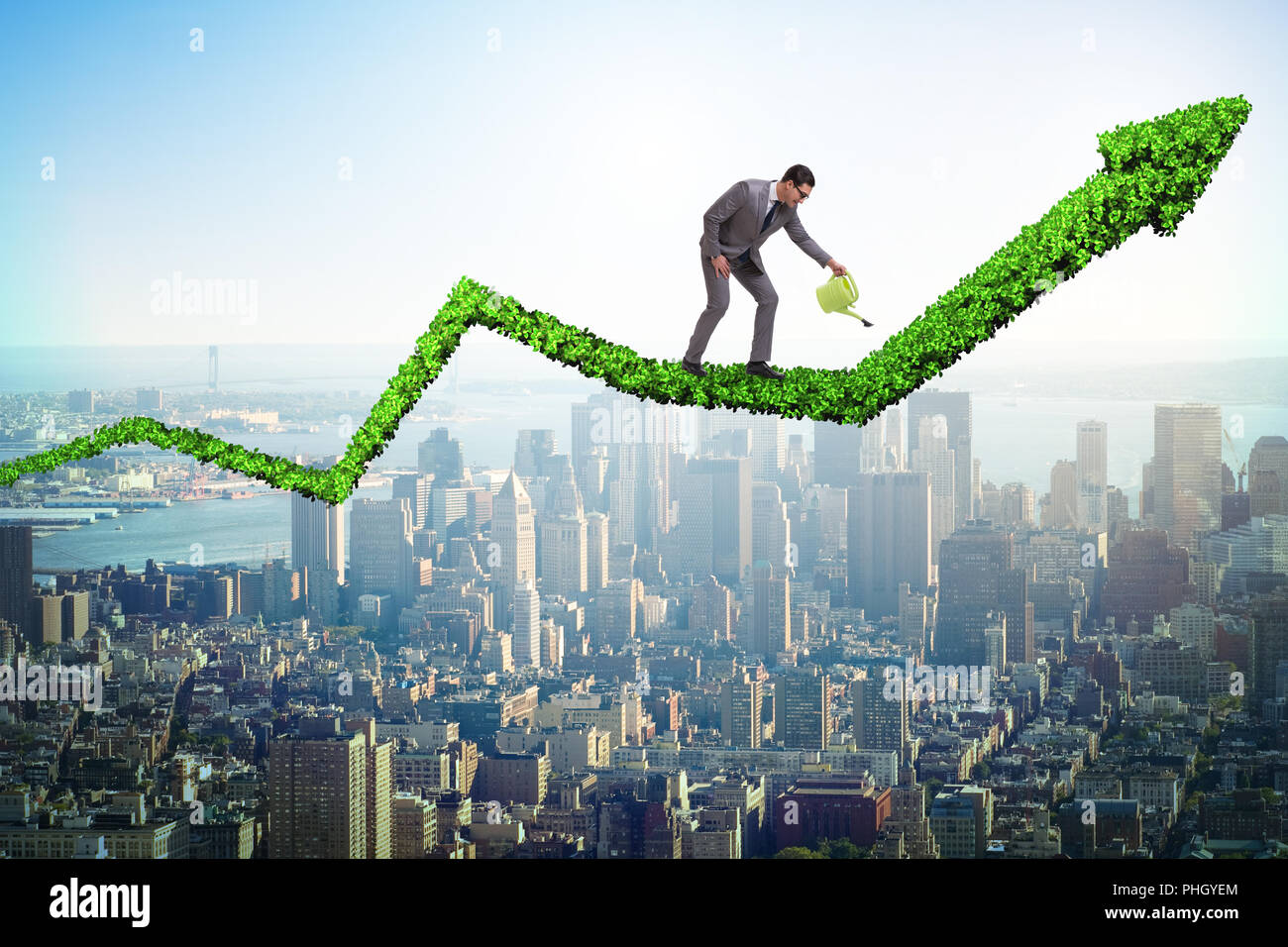 Businessman in investment concept watering financial line chart Stock ...